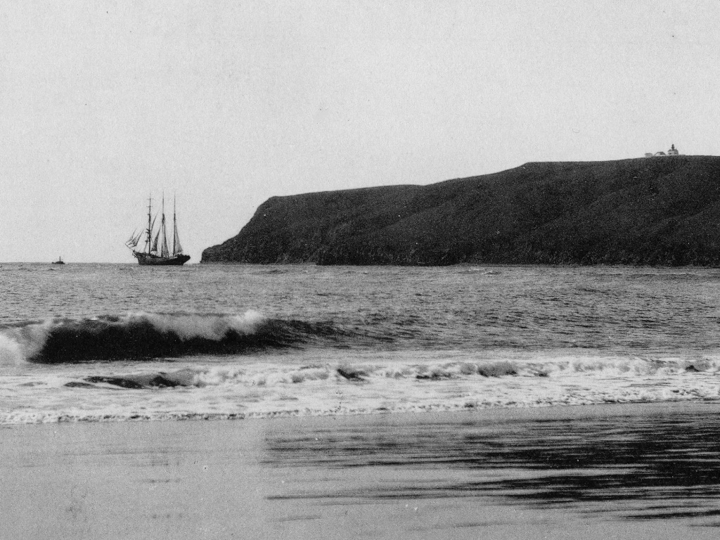 Ship sailing by Point Loma, old lighthouse in view | The Log